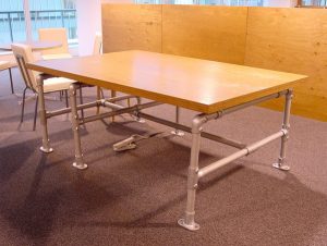 Industrial office design: Tables, shelving, screens and rails
